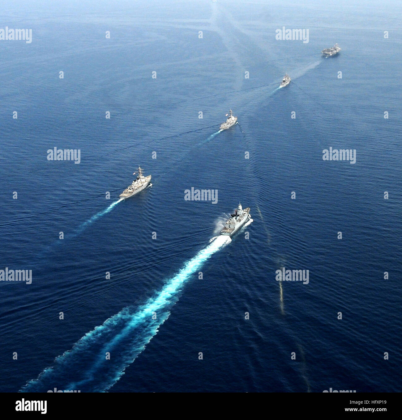 The German navy air defense frigate FGS Hessen, right, breaks formation ...
