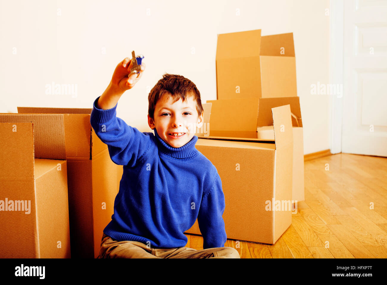 little cute boy in empty room, remoove to new house. home alone ...