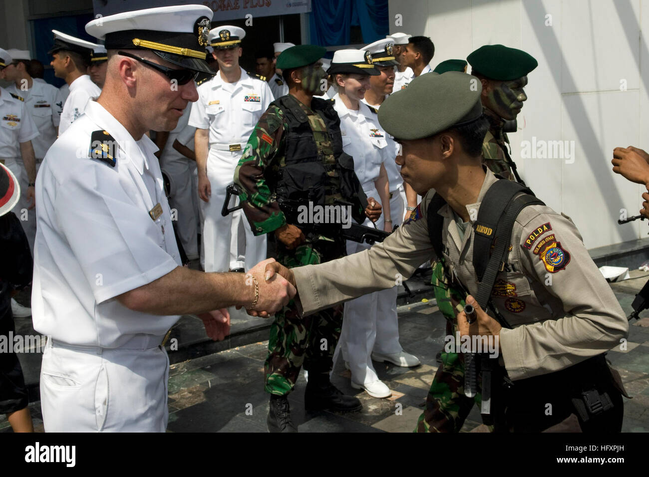 Sailors aboard the guided-missile submarine USS Georgia stand in ...