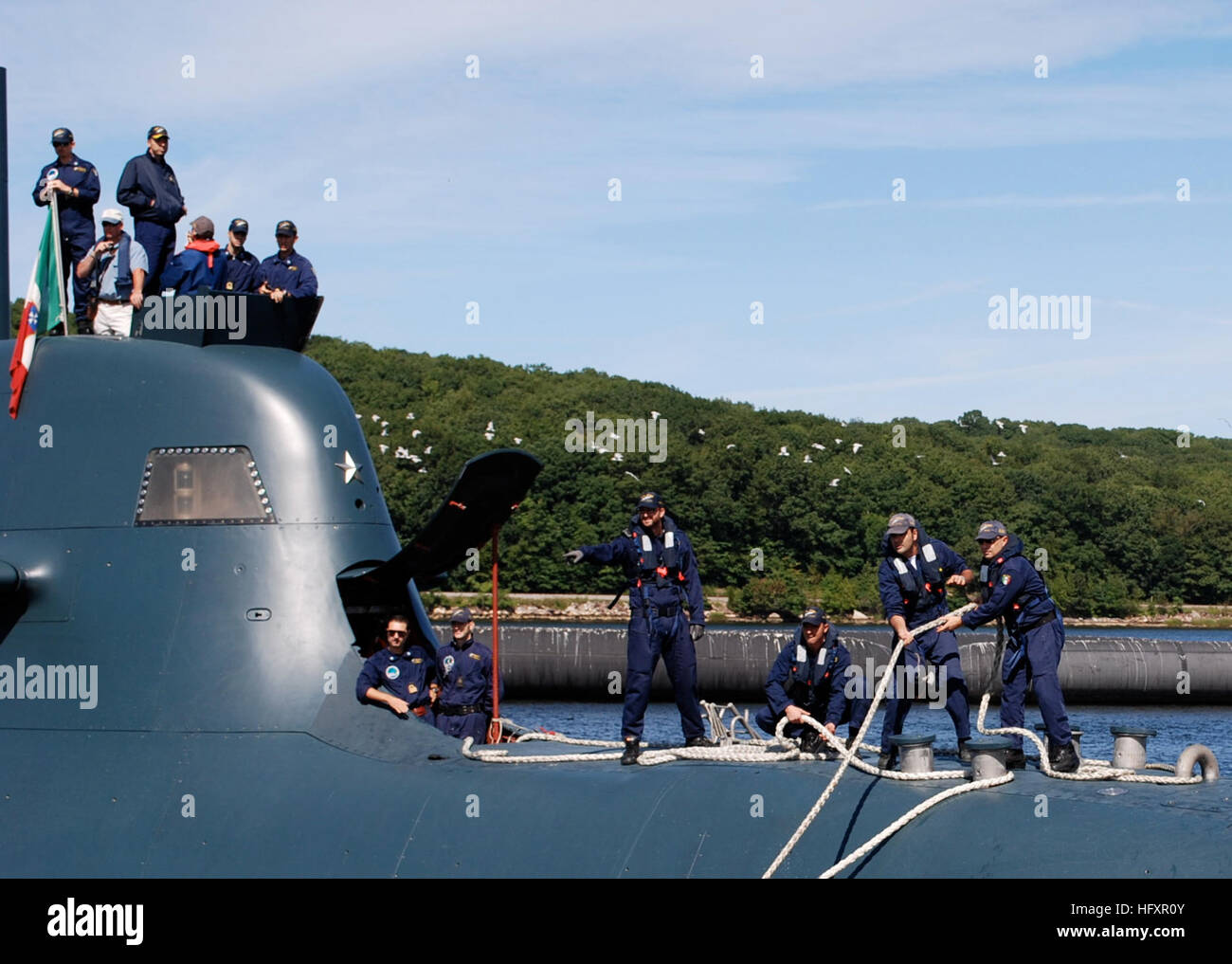 Line handlers aboard the Italian Todaro-class submarine Scire (S527 ...