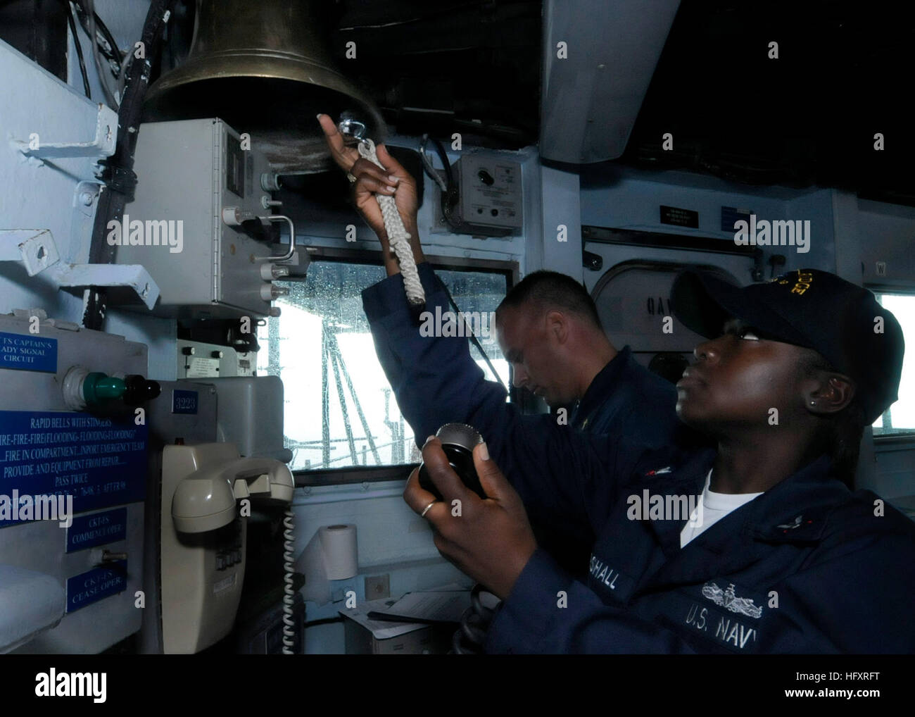 Petty Officer 2nd Class Dale Marshall, boatswain's mate, rings eight ...