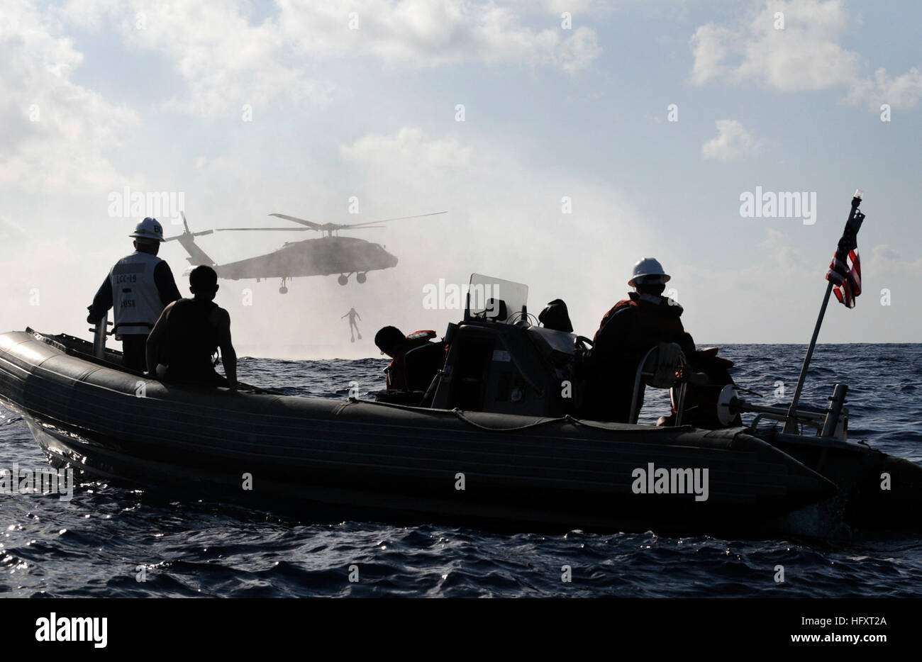 The amphibious command ship USS Blue Ridge search and rescue boat ...
