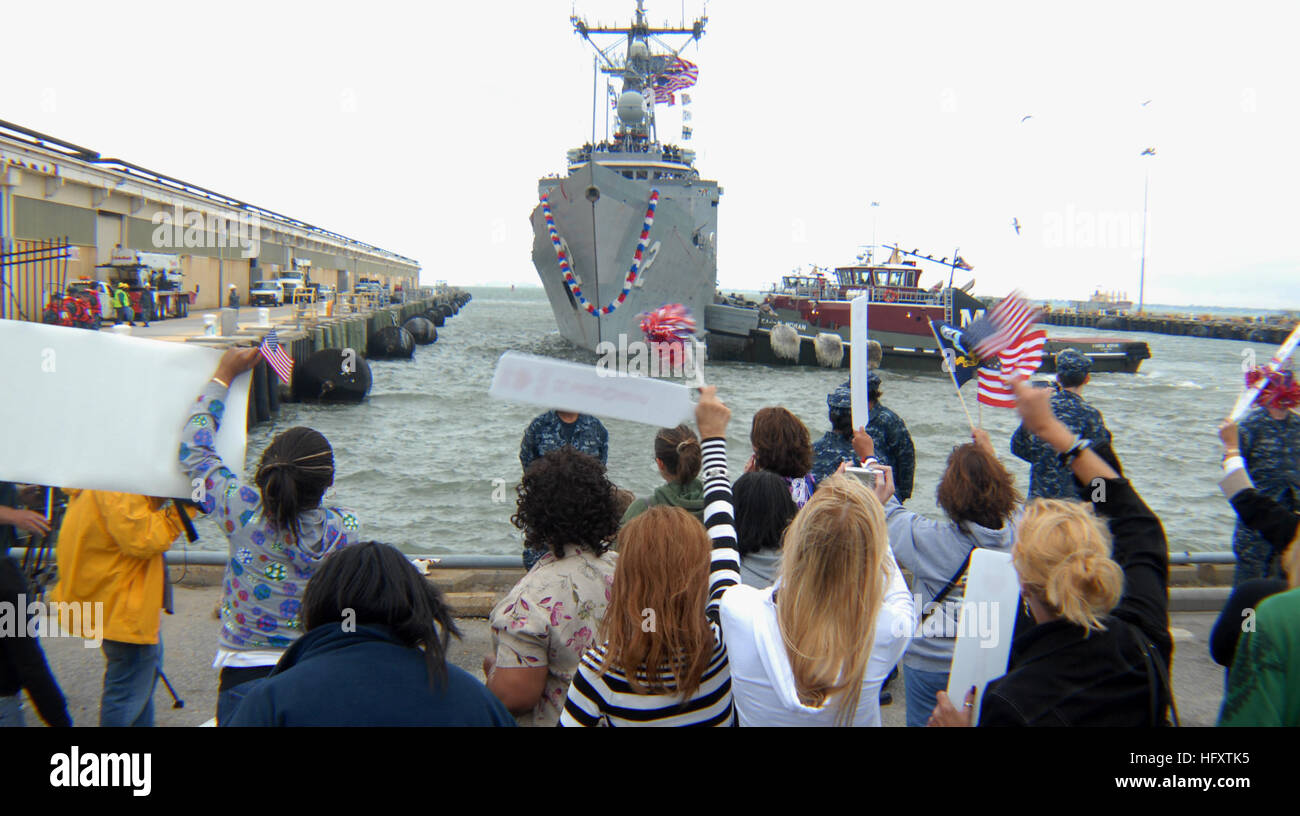 091007-N-6764G-021 NORFOLK (Oct. 7, 2009) Family and friends await the ...