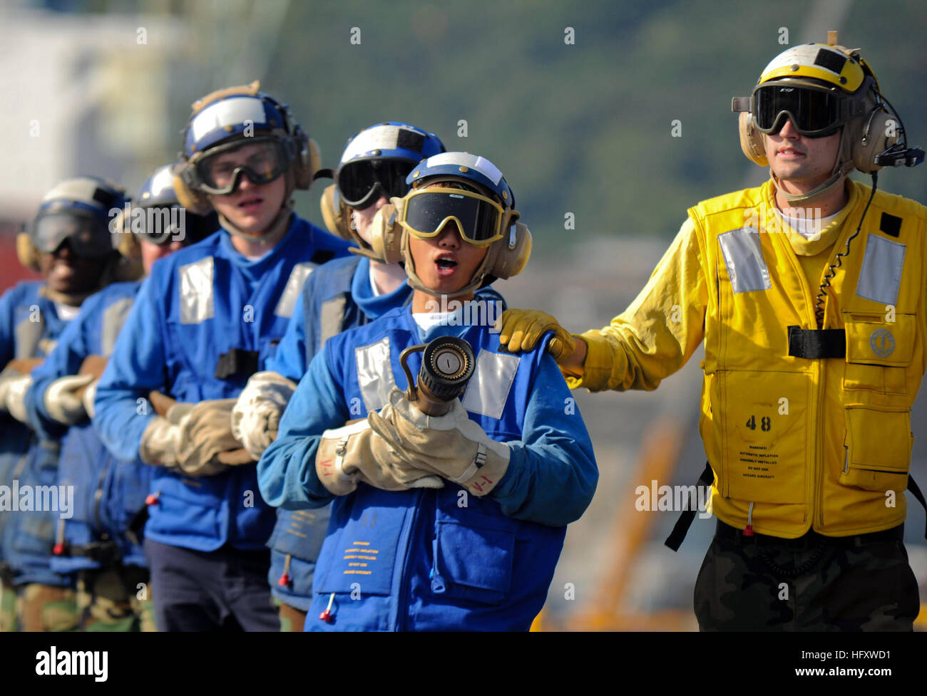 Sailors from the air department aboard USS Essex (LHD 2) conduct a fire ...