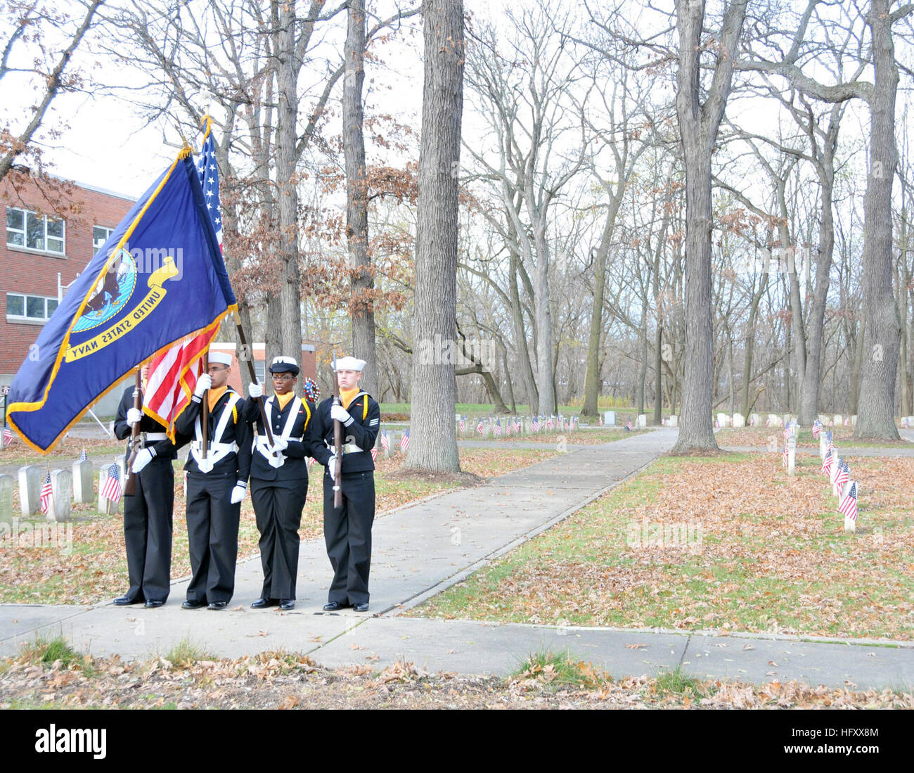 U.S. Sailors with a color guard unit present the colors for the ...