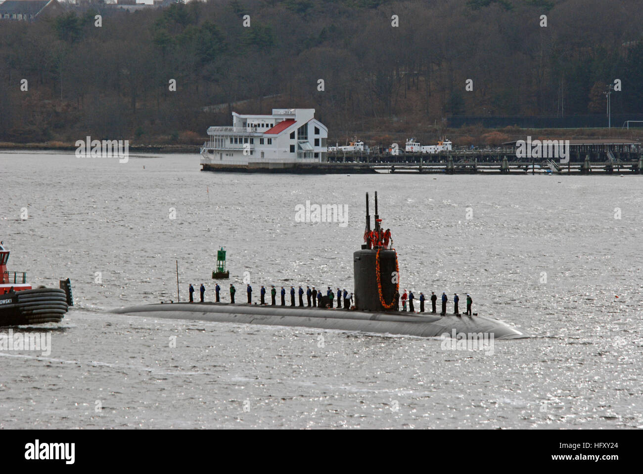 Sailors aboard the Los Angeles-class submarine USS Miami (SSN 755) man ...