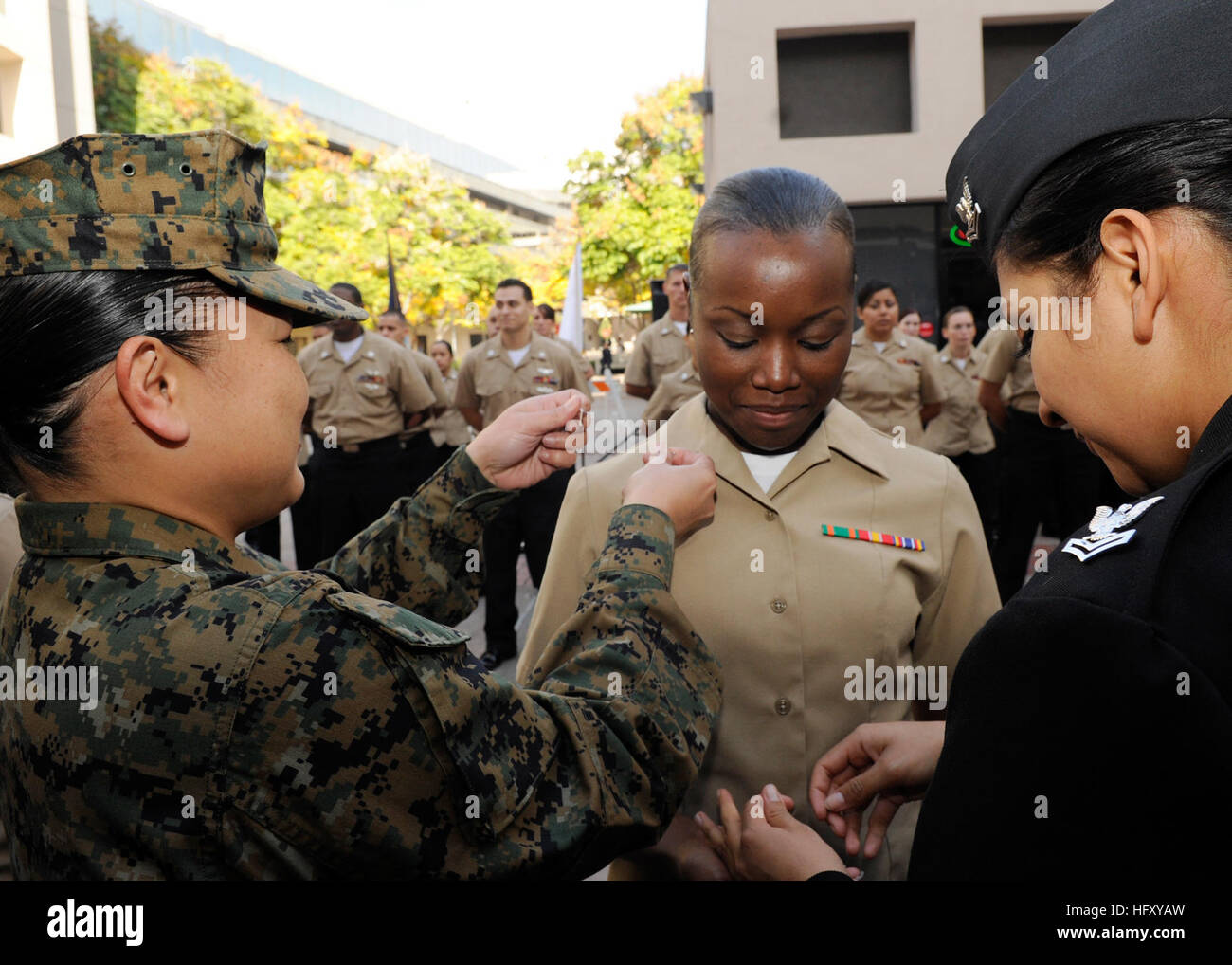Hospital Corpsmen receive advancement crows during a frocking ceremony ...
