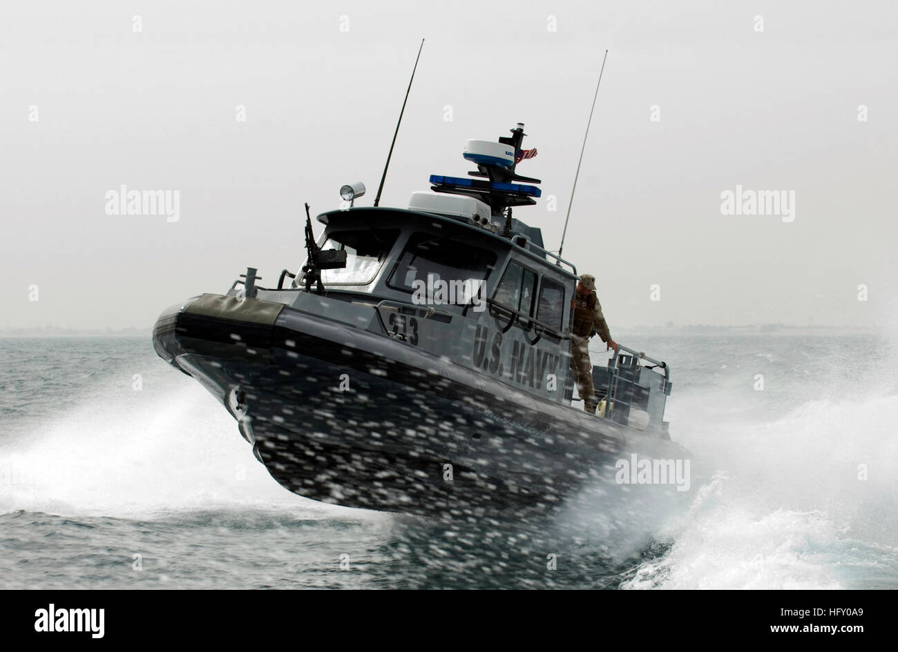 US Navy 090210-N-9671T-144 A port security boat patrols the waters near ...