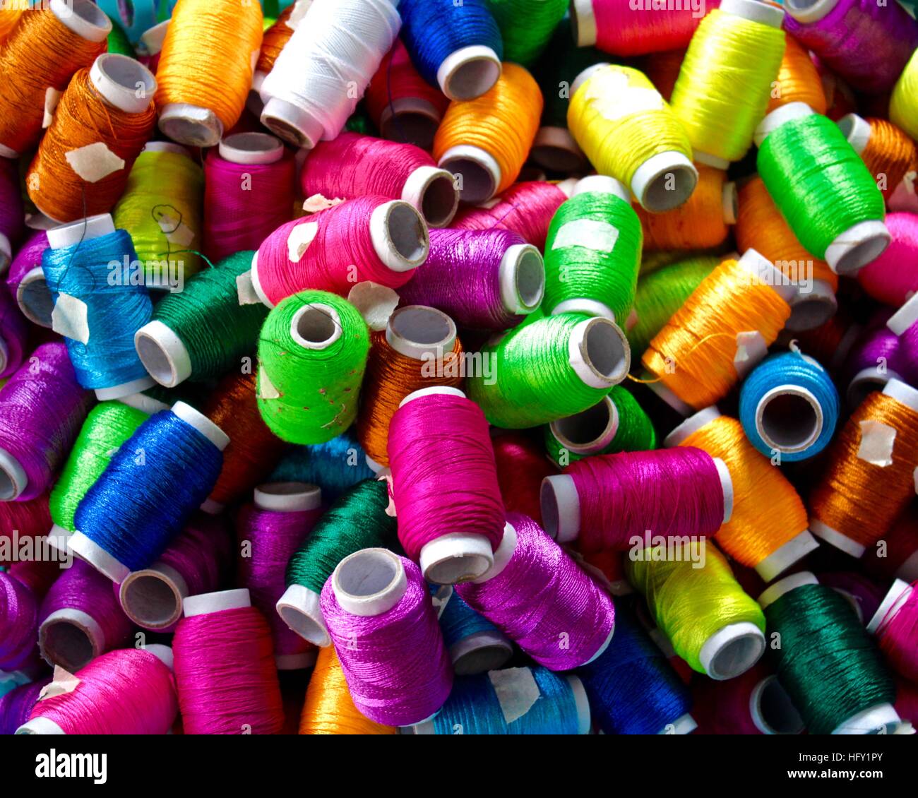 Colorful sowing thread Stock Photo - Alamy