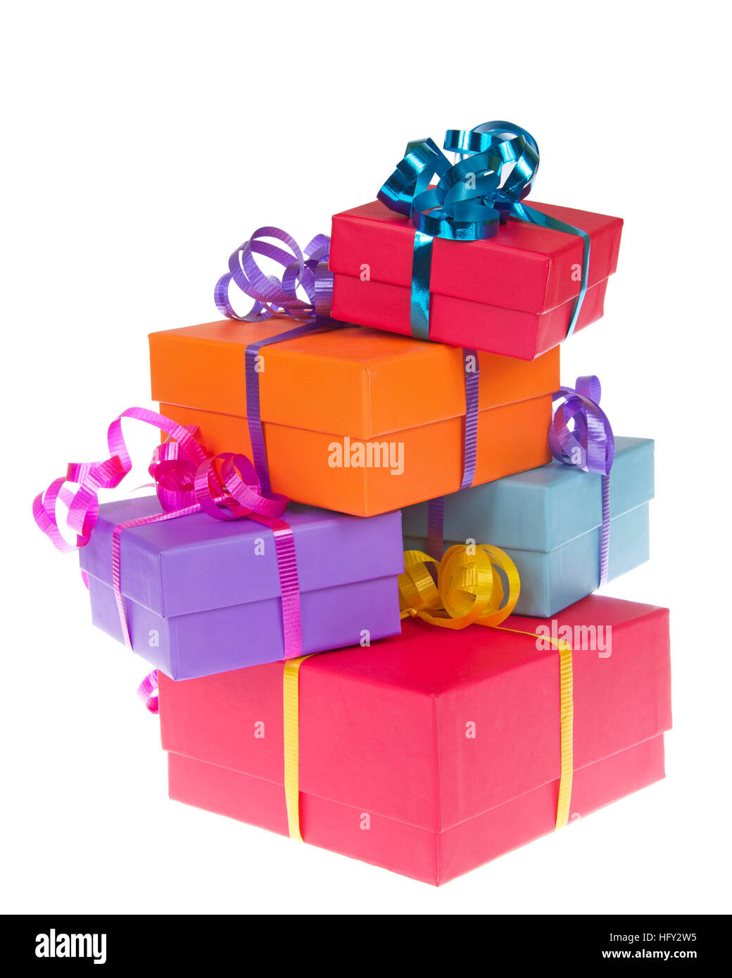 colorful present boxes with ribbon stacked asymetrically and randomly ...