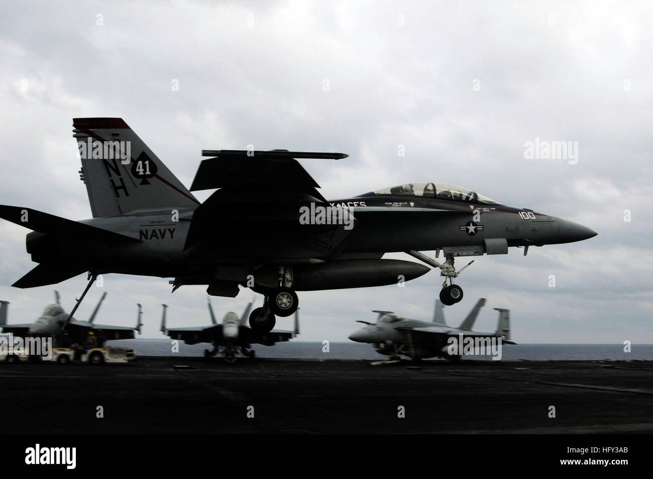 An F/A-18F Super Hornet from VFA-41 Black Aces lands on USS Nimitz ...