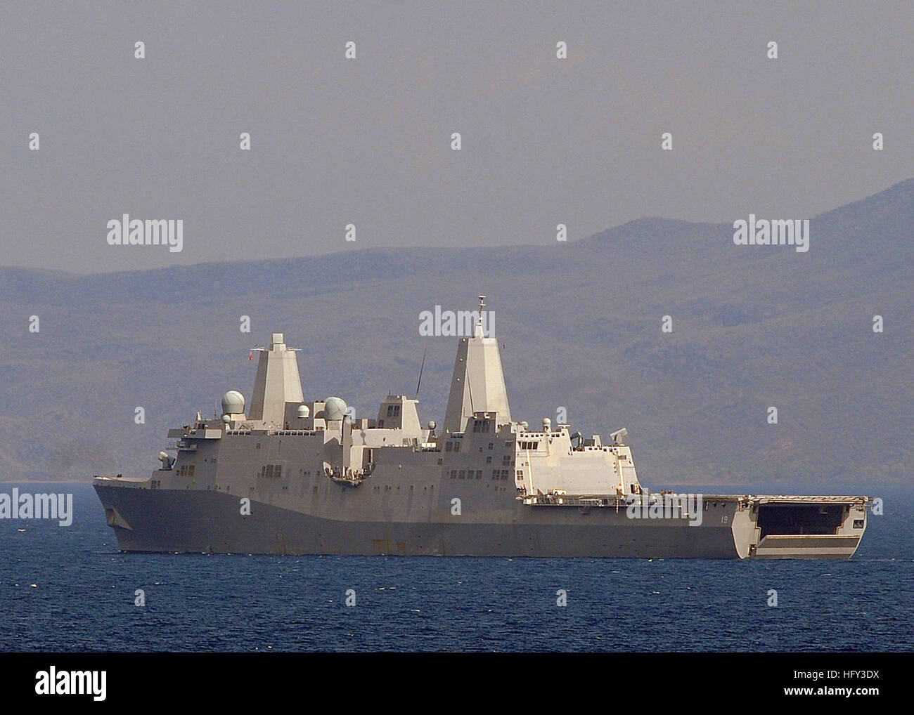 USS Mesa Verde (LPD 19) transits near the coast with embarked Marines ...