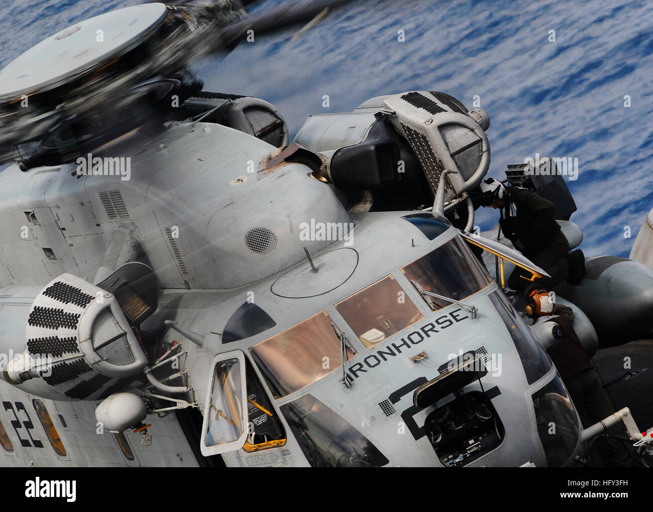 Plane captains conduct pre-flight checks on an MH-53E Sea Dragon ...