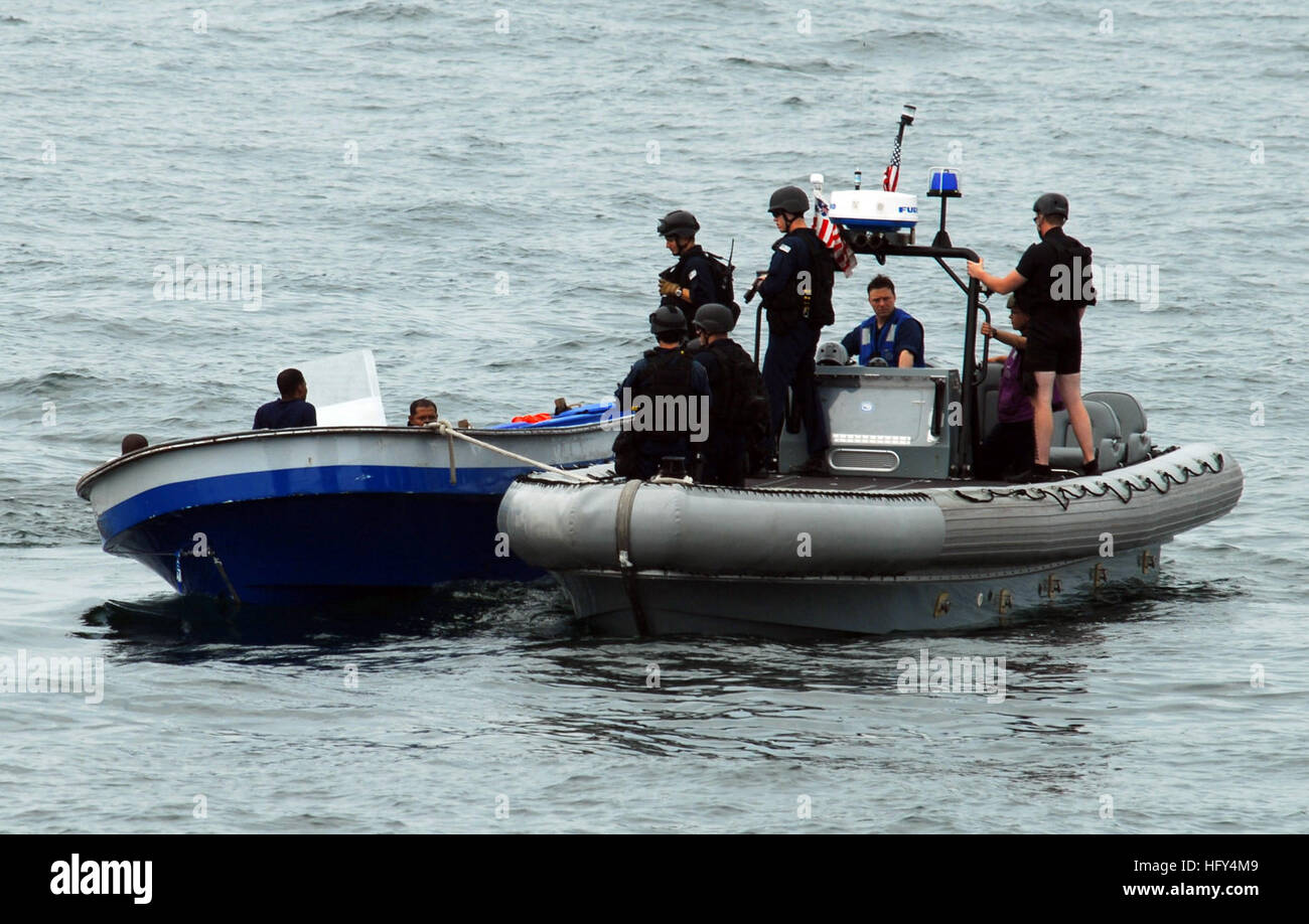 A response team from USS Freedom and Coast Guard personnel interrogate ...