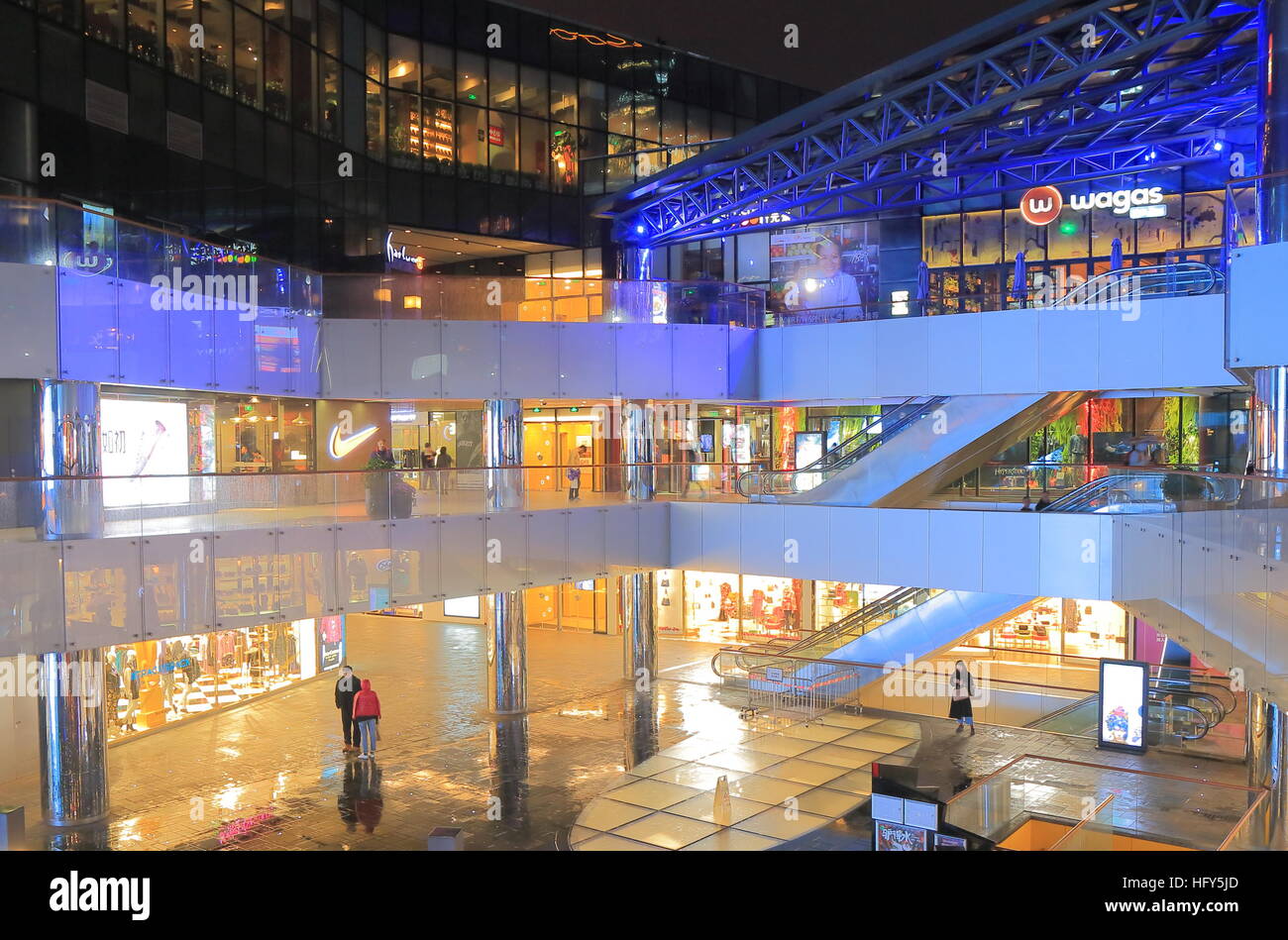 People visit Sanlitun village Tai Koo Li shopping mall in Beijing China ...