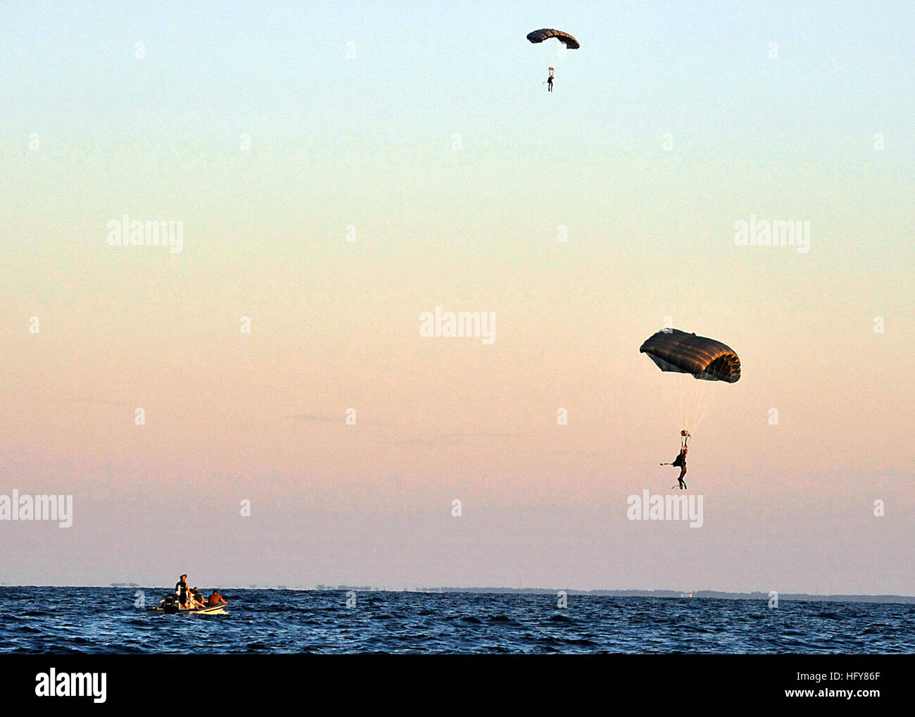 Navy SEALs and special warfare combatant-craft crewmen parachute during ...