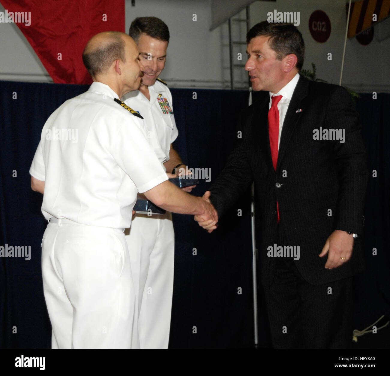 Rear Adm. Patrick Driscoll, center, commander of Strike Group 10, and ...