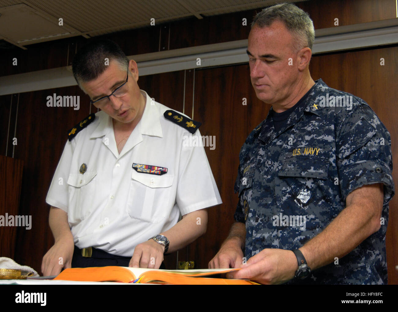French navy Catholic chaplain Pascal Frey, left, reads scriptures with ...
