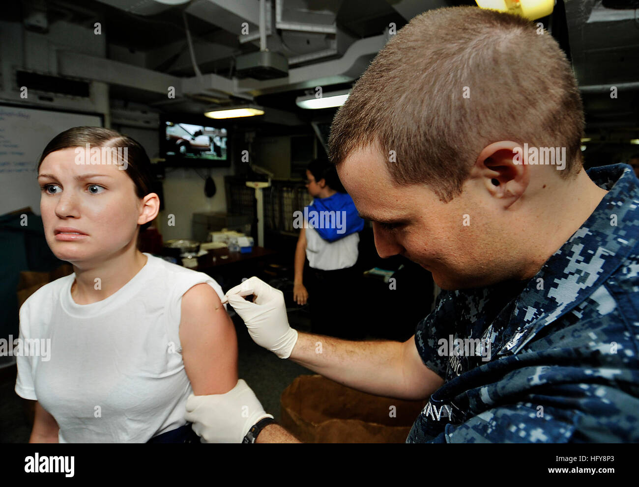 A Sailor receives a vaccination from a Hospital Corpsman aboard the ...