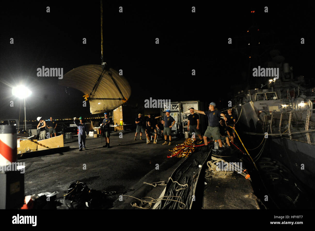 A controllable pitch propeller blade is being hoisted out of the water ...