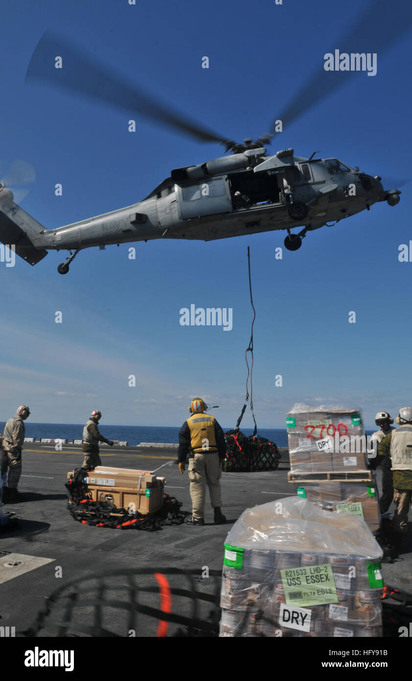 An MH-60S Sea Hawk helicopter from HSC-25 delivers supplies to USS ...