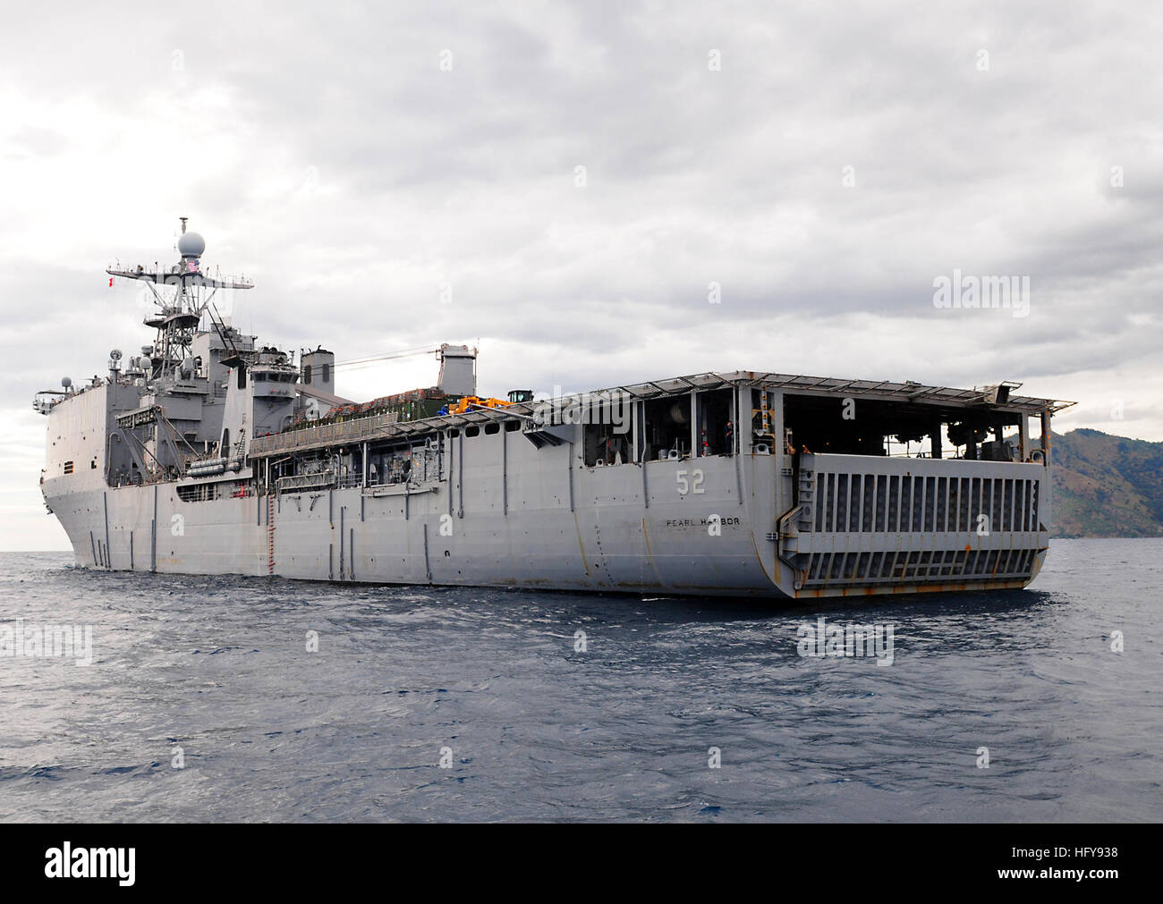 The amphibious dock landing ship USS Pearl Harbor is seen off the coast ...
