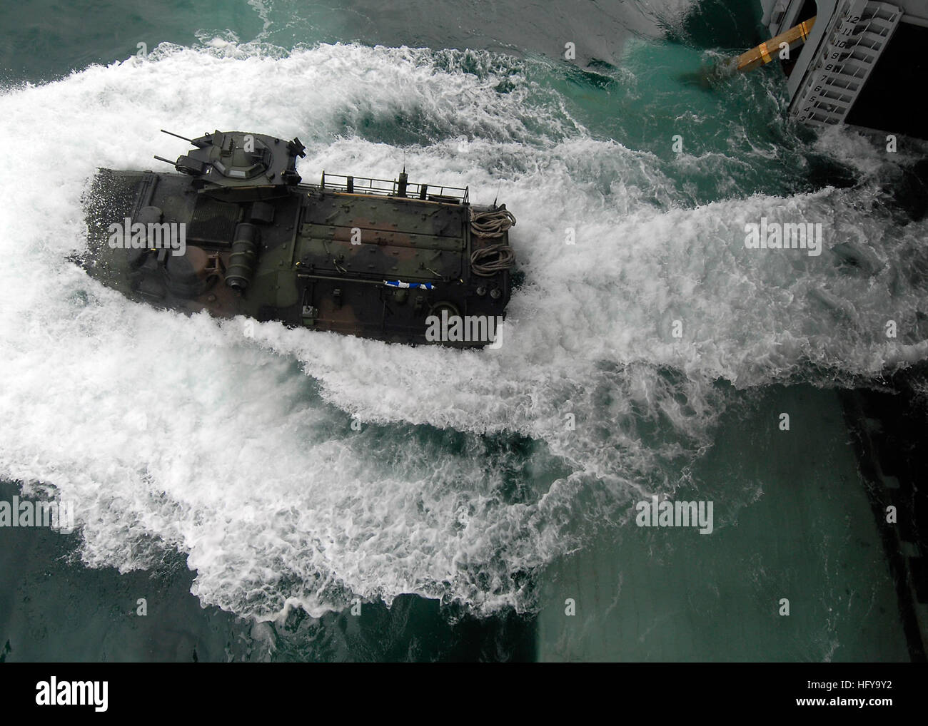An amphibious assault vehicle launches from USS Boxer well deck during ...