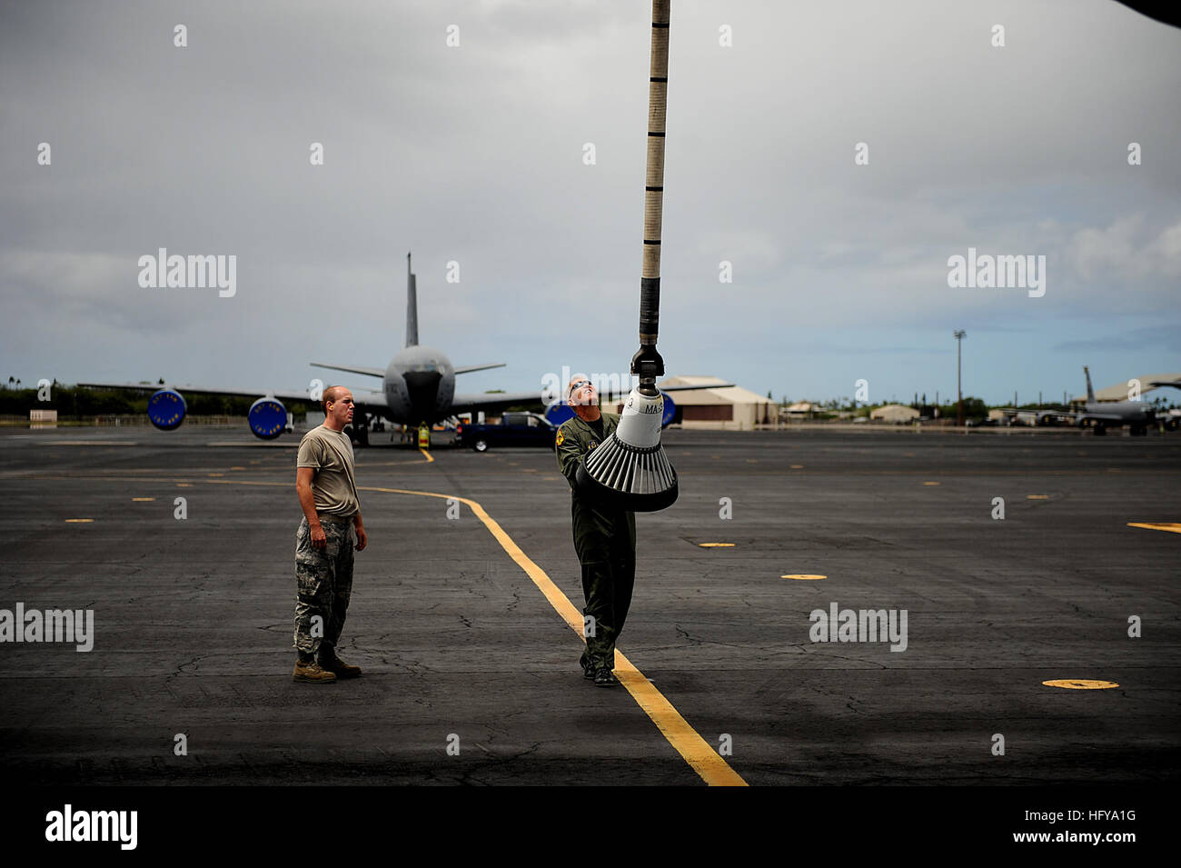 Aircrew member conducts pre-flight inspection for a refueling mission ...