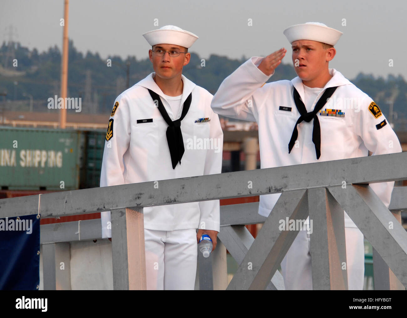 A Sea Cadet aboard USS Green Bay salutes the national ensign during a U ...