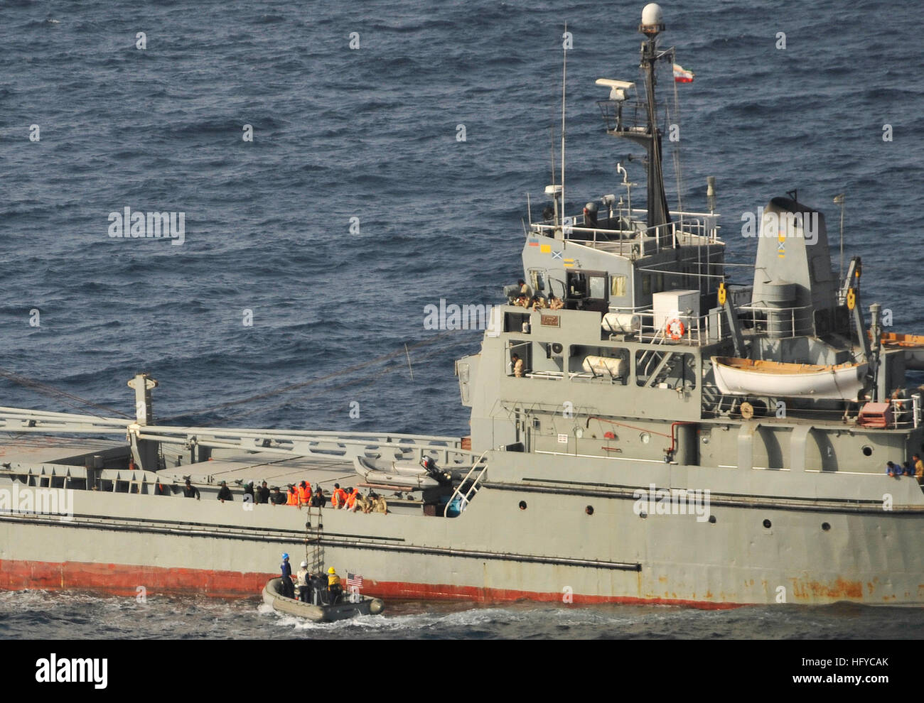 Eight mariners board the Iranian navy ship Chiroo from a rigid-hull ...