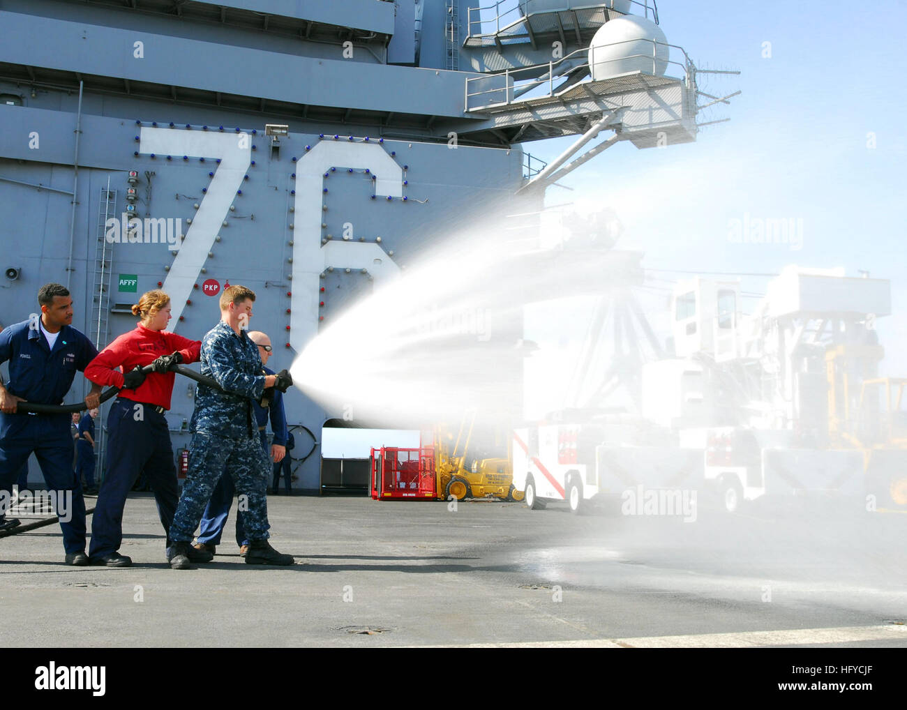 Aircrew aboard USS Ronald Reagan (CVN 76) conduct a flight deck AFFF ...