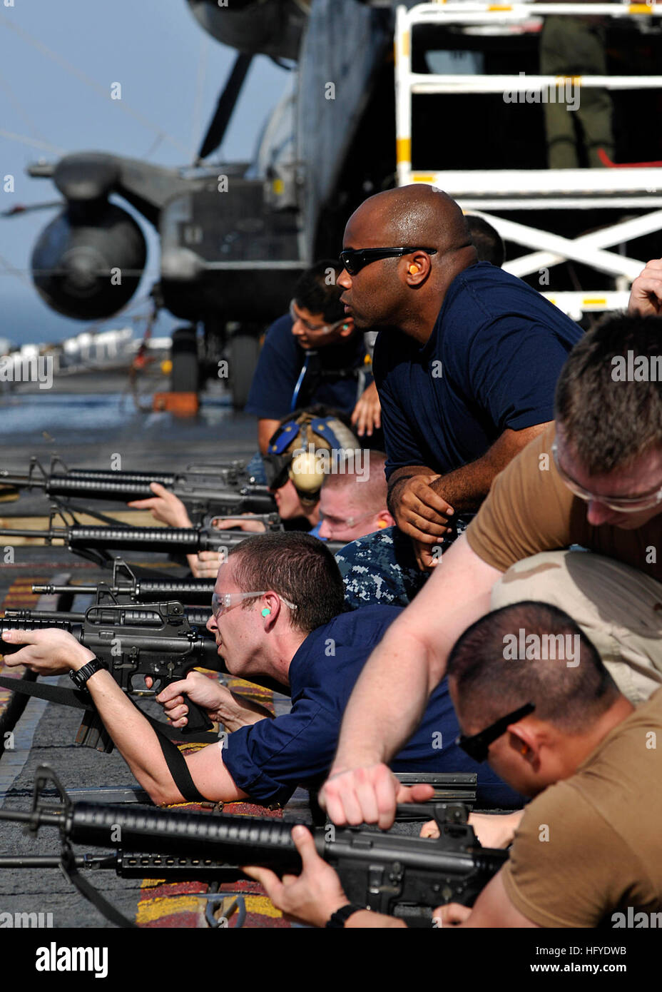 Petty Officer 1st Class Darsay Barnwell coaches Sailors qualifying with ...