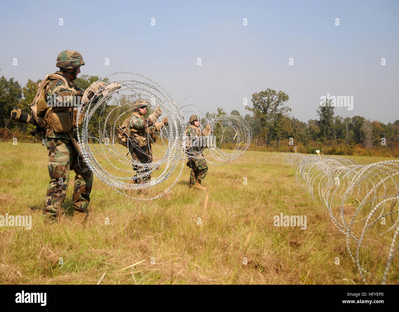 Triple strand concertina wire hi-res stock photography and images - Alamy