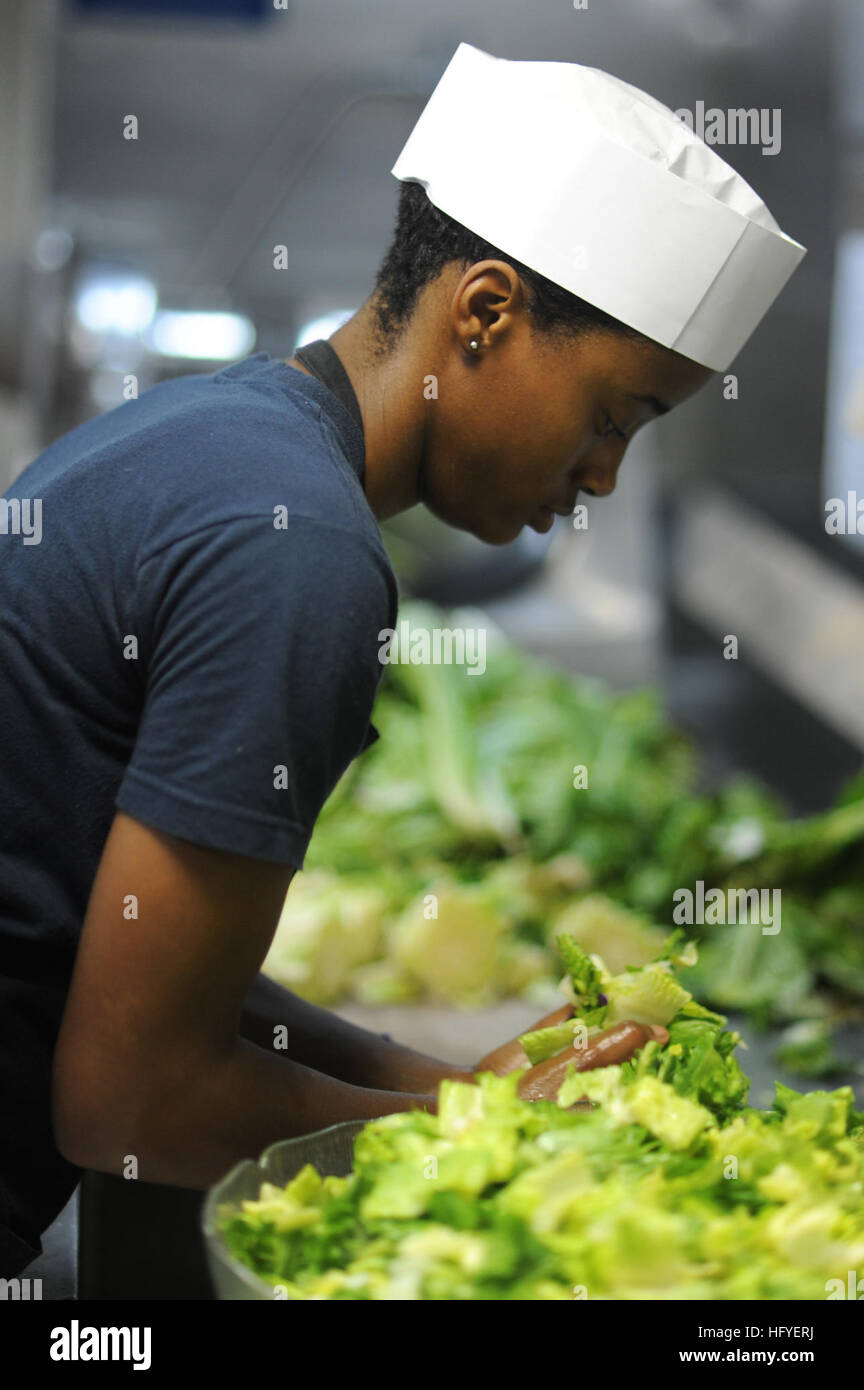Culinary personnel aboard USS Harry S. Truman (CVN 75) prepare meals on ...