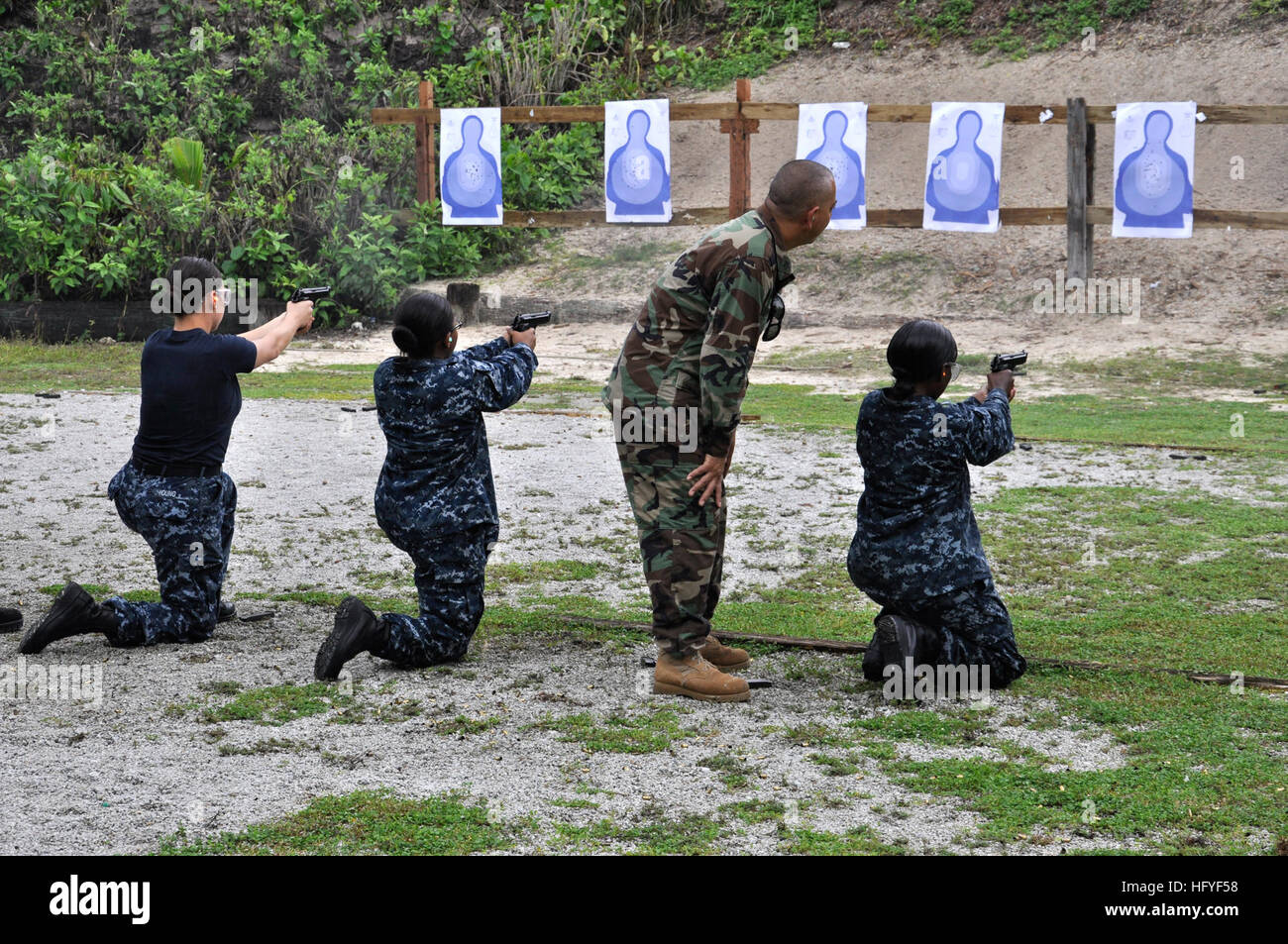 101020-N-9402T-086 DIEGO GARCIA (Oct. 20, 2010) Sailors fire M9 Beretta ...
