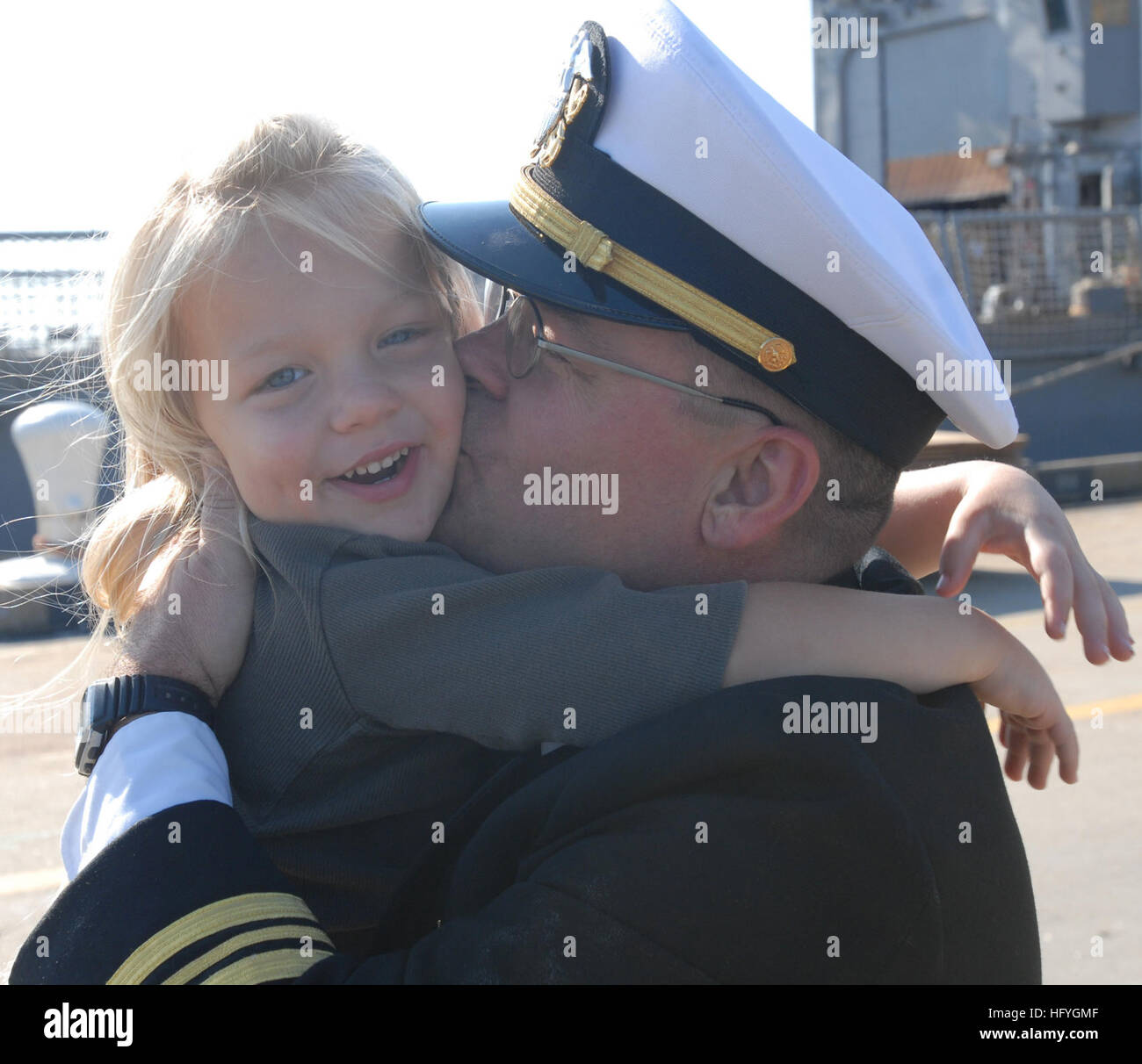 Lt. Cmdr. Jon Rigby is greeted by his daughter at Naval Station Norfolk ...