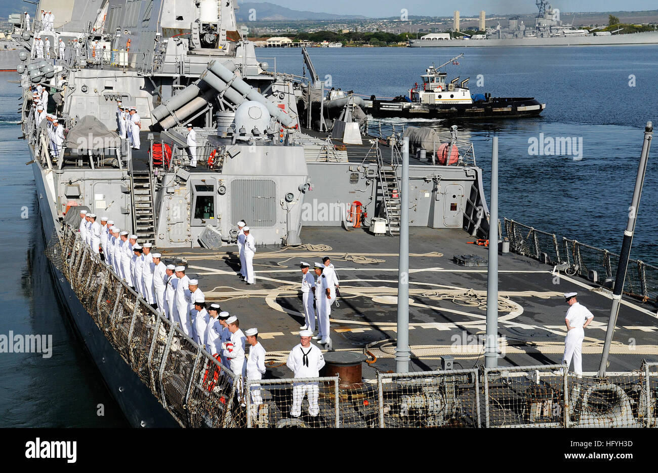 Sailors assigned to the guided-missile destroyer USS Paul Hamilton man ...