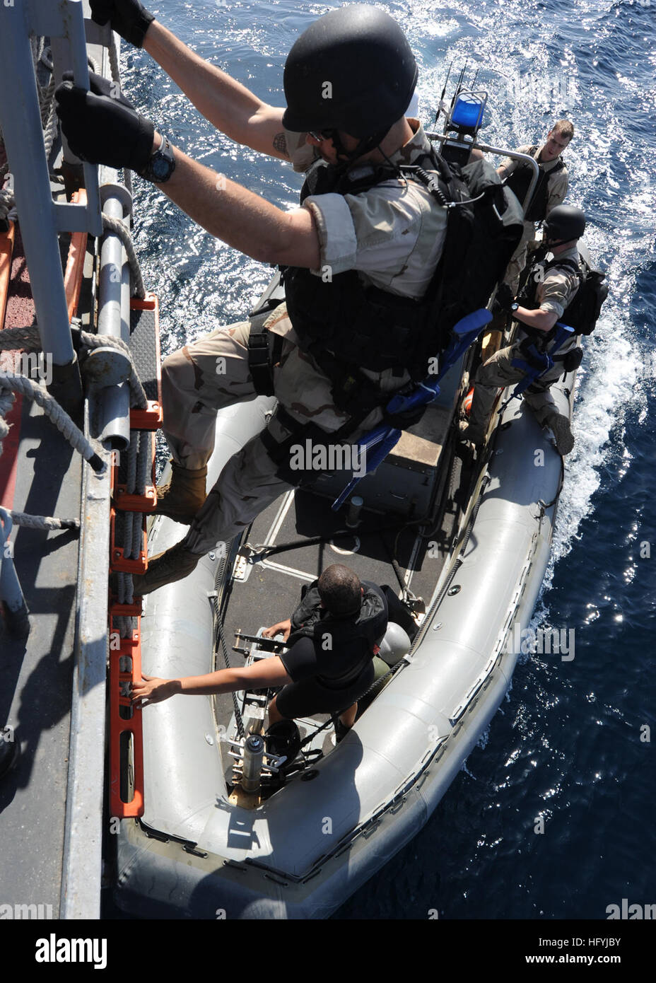 A Coast Guard Law Enforcement Detachment member aboard USS Lake ...