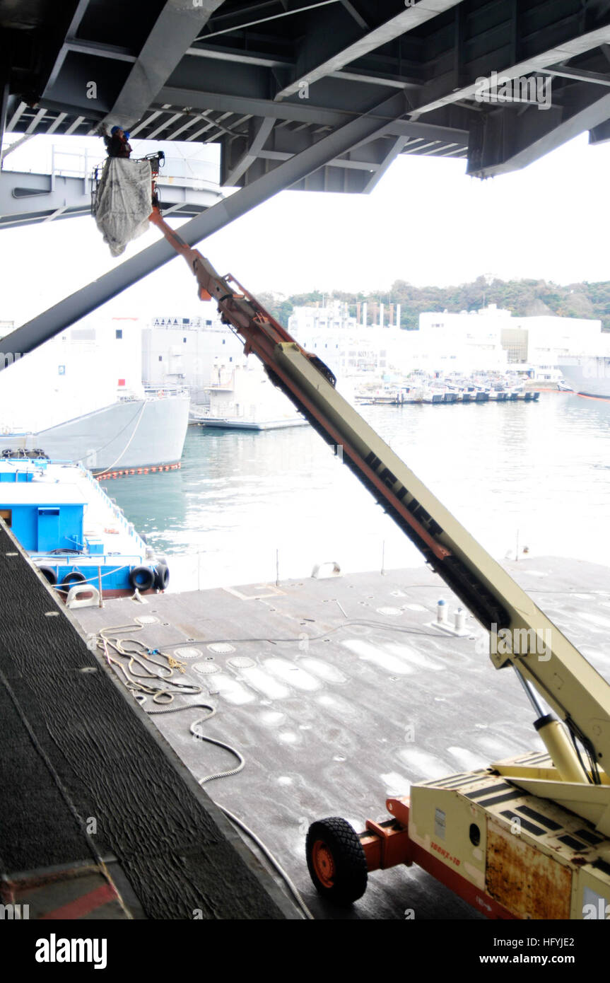 Navys only permanently forward deployed aircraft carrier hi-res stock ...