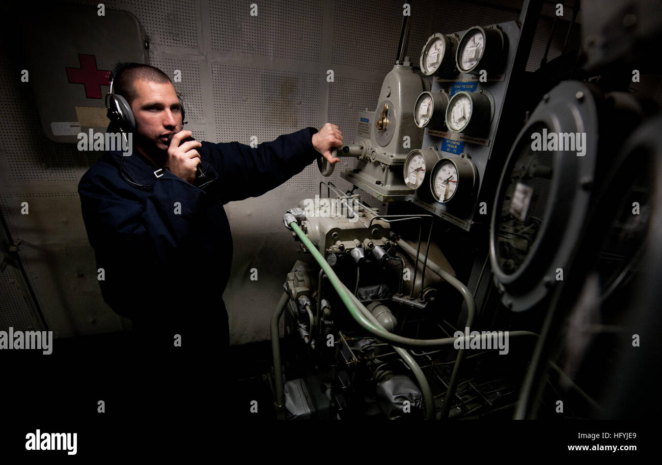 Seaman Jesus Velasquez, boatswain's mate, tests a sound-powered ...