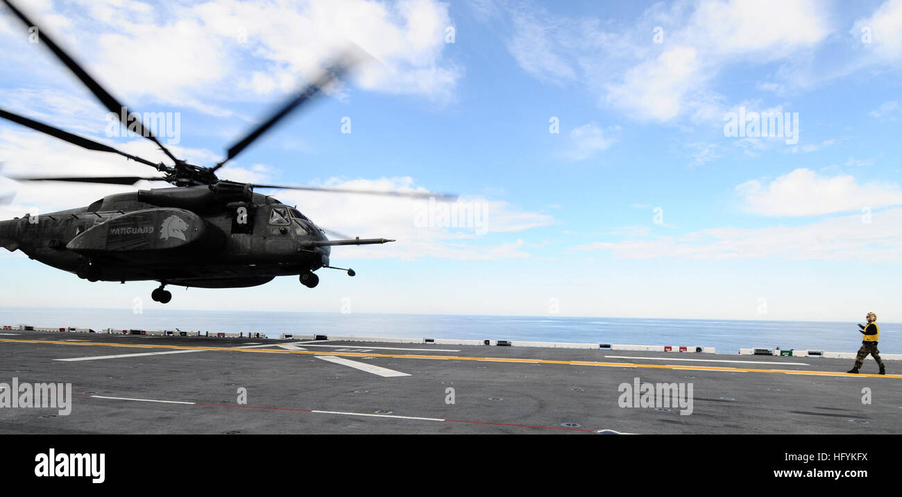 An MH-53E Sea Dragon helicopter assigned to Mine Countermeasures Squadron 14 lands aboard the ...