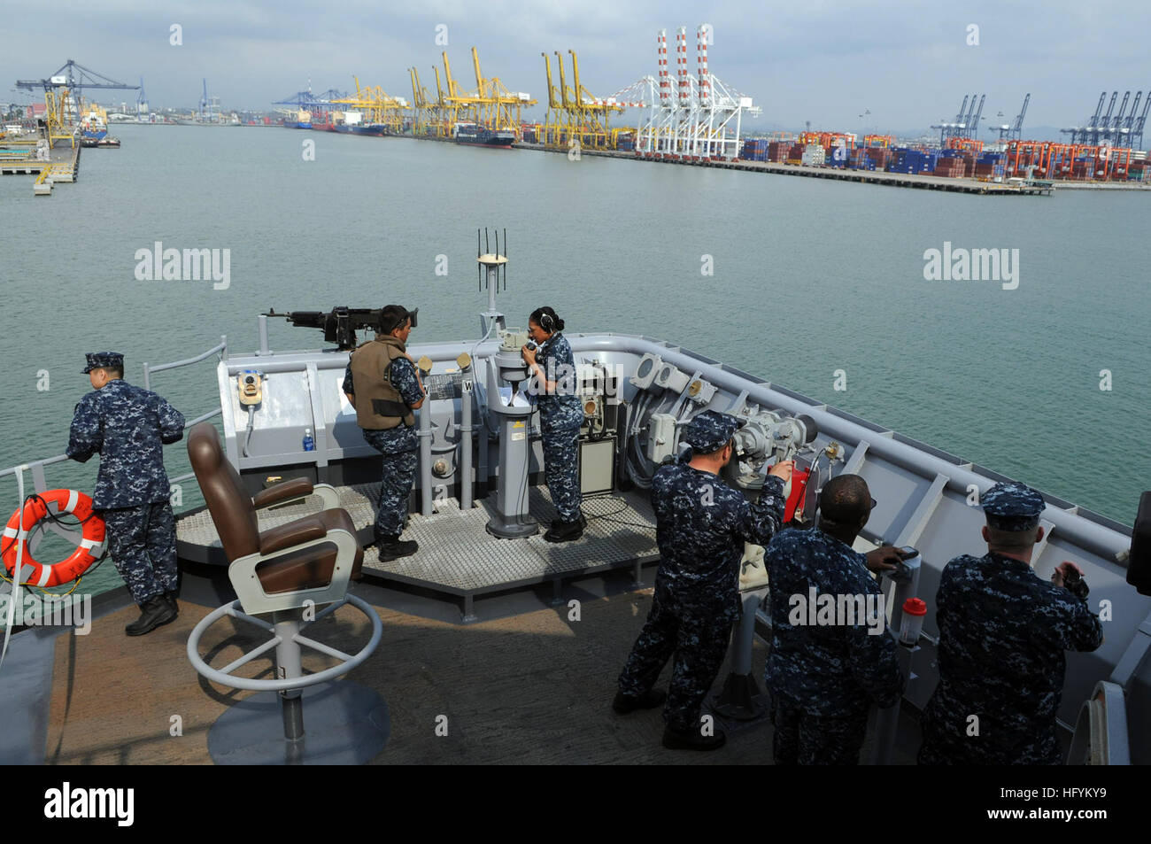 Sailors stand watch on the port bridge wing aboard USS Germantown as it ...