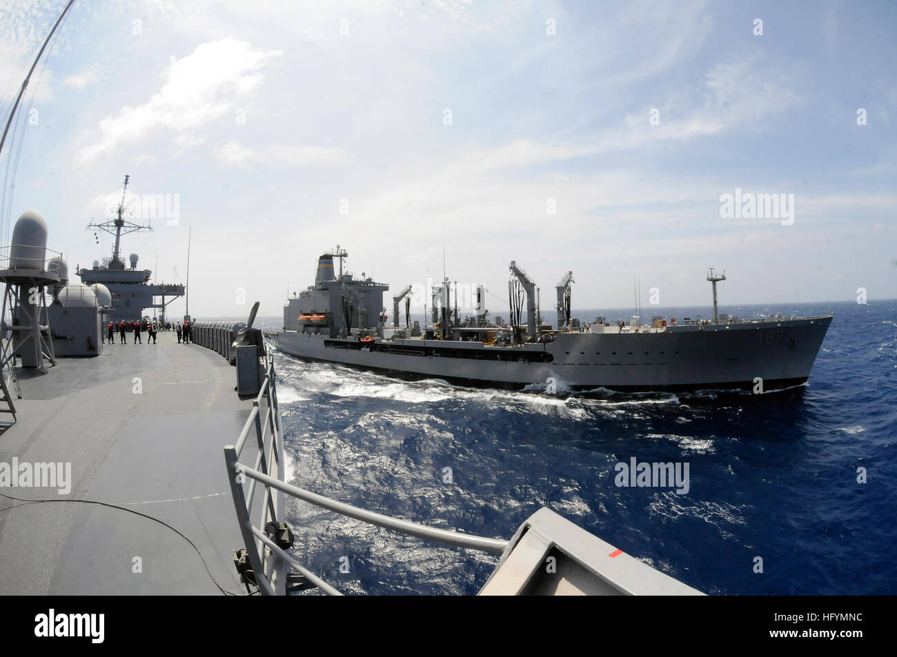 The Military Sealift Command replenishment oiler USNS Pecos conducts a ...