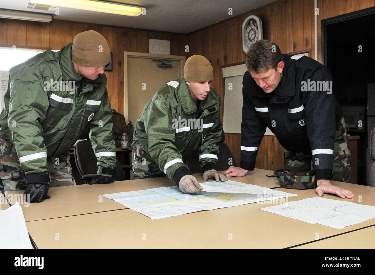Underwater Construction Team 2 personnel review port charts and conduct ...