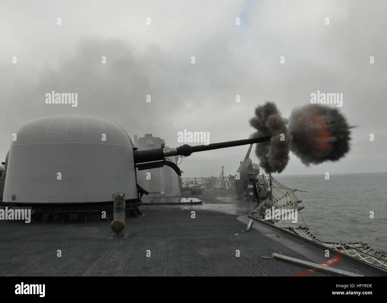 USS Thach fires its MK-75 76mm gun while underway off Brazil during ...