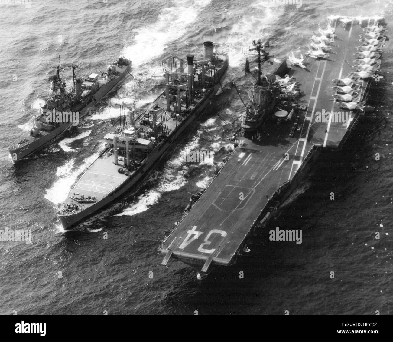 USS Oriskany (CVA-34) and USS Morton (DD-948) replenishment 1974 Stock ...