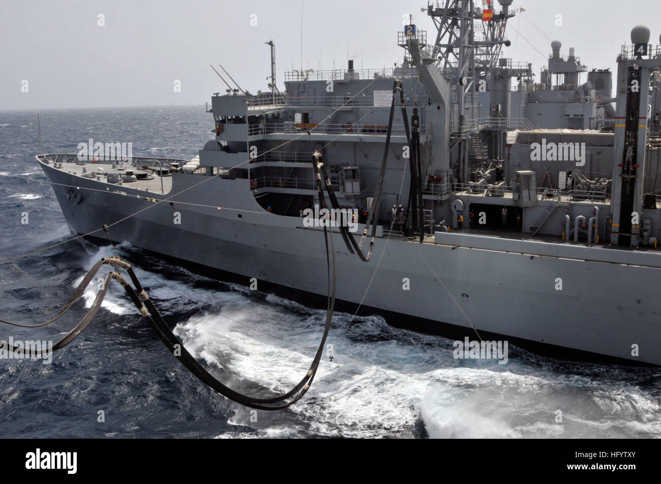 The Military Sealift Command fast combat support ship USNS Bridge transfers fuel to the ...