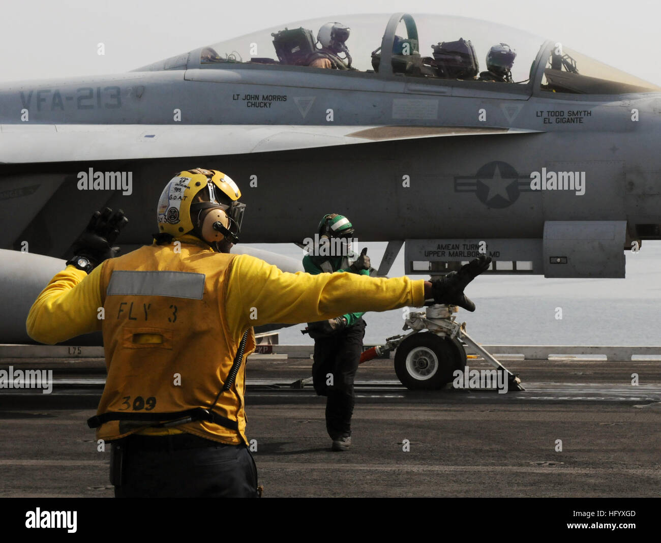 110708-N-XE109-081 ARABIAN GULF (July 8, 2011) Sailors signal the ...