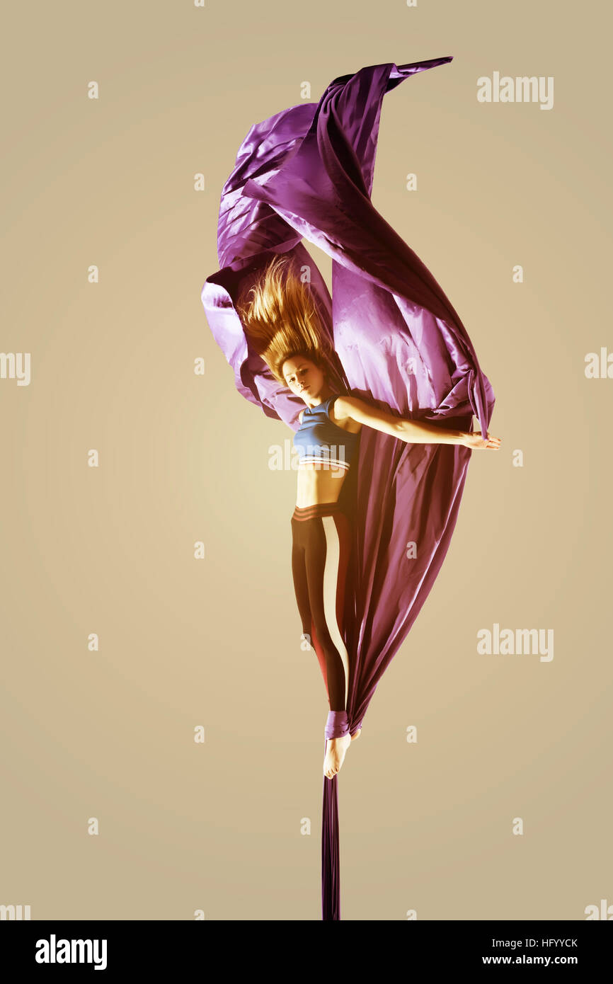 Aerial acrobatics acrobat girl isolated Stock Photo - Alamy