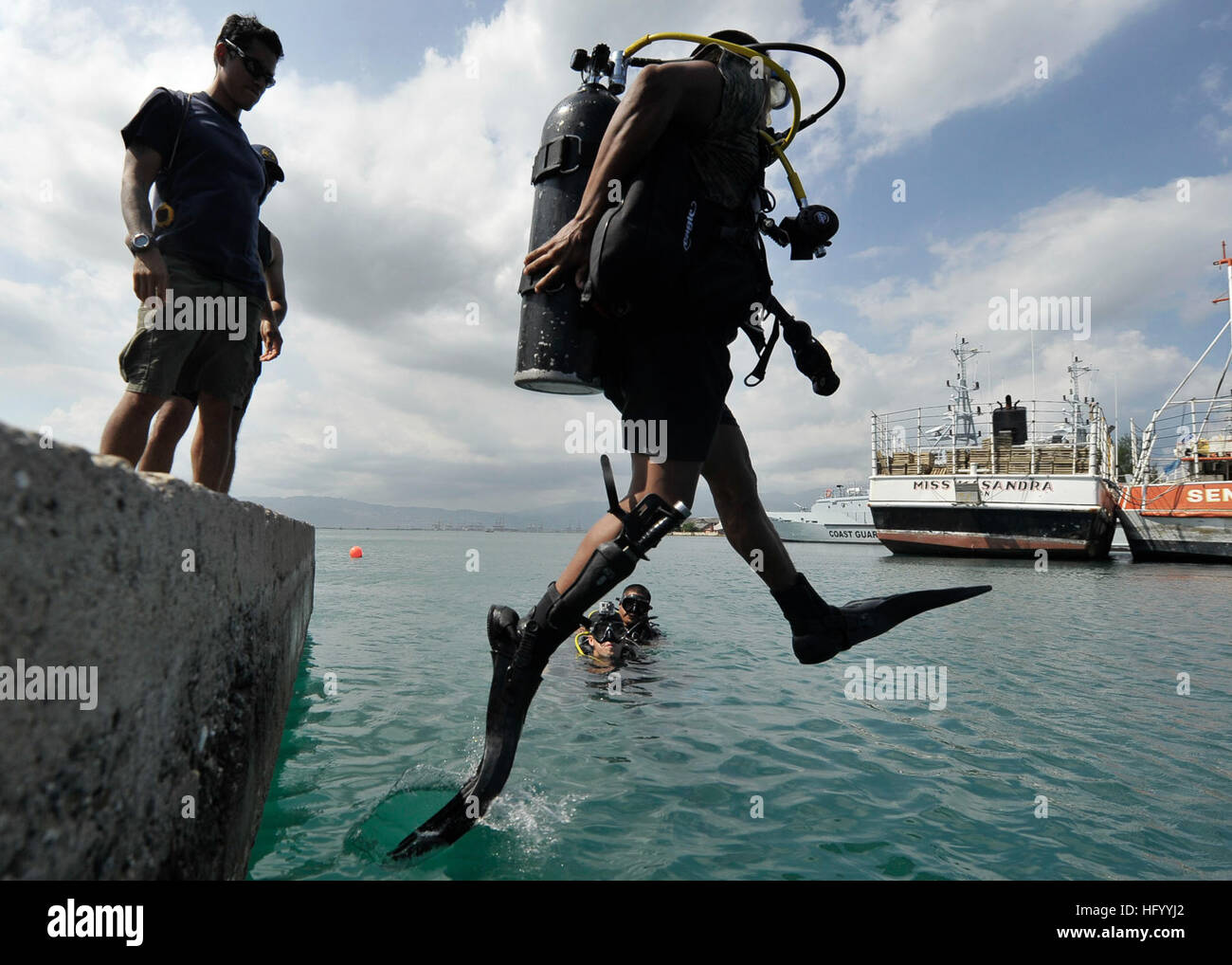 A Guatemala Navy diver conducts a front step entry before search ...